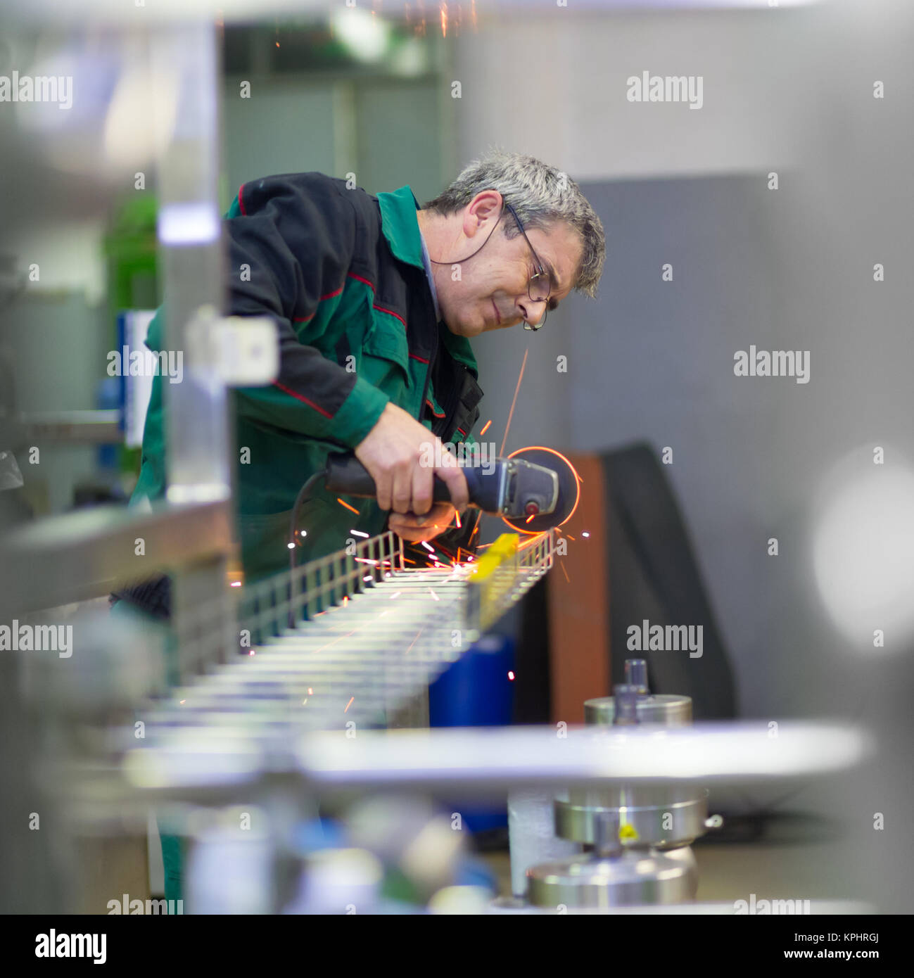 Industrial worker grinding in manufacturing plant Stock Photo - Alamy