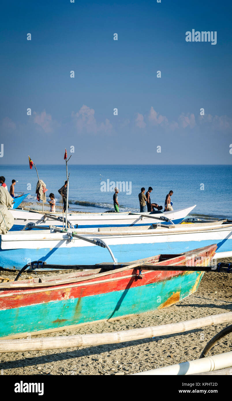 coast with traditional fishing boats on dili beach in east timor leste ...