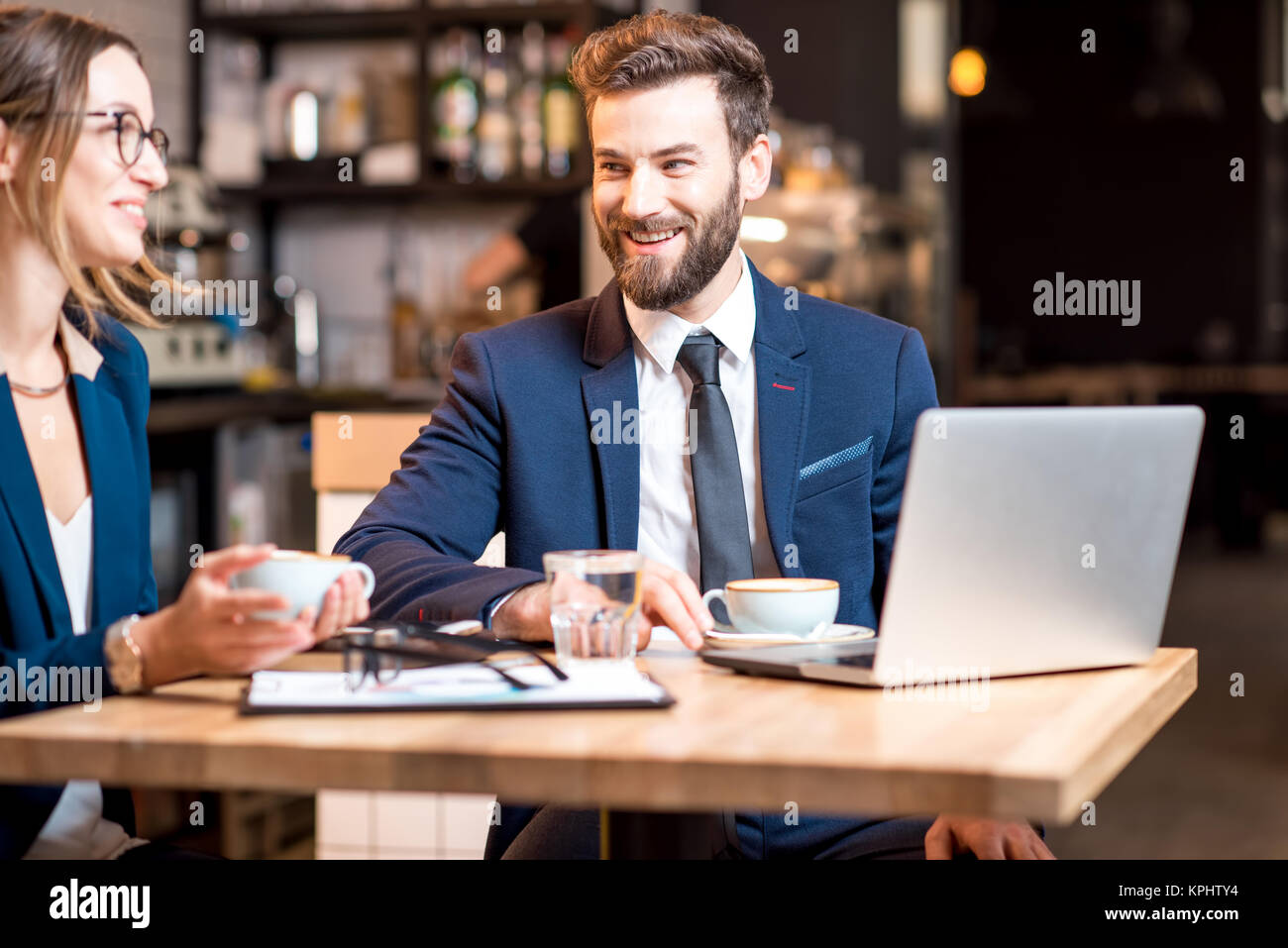 Conversation between young business hi-res stock photography and images ...