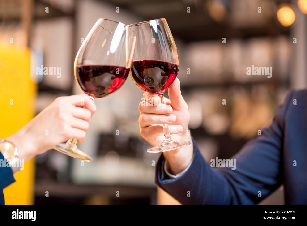 Woman clinking glasses wine hi-res stock photography and images - Alamy