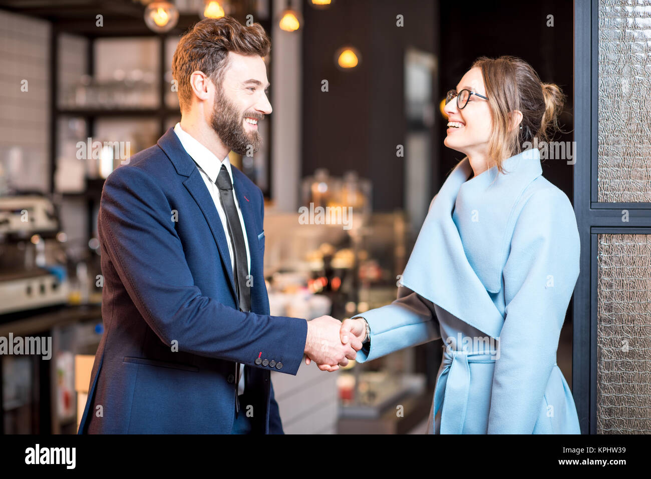 Business couple at the restaurant Stock Photo - Alamy