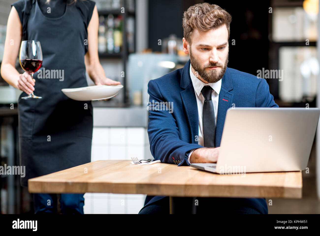 Businessman waiting for the order Stock Photo - Alamy