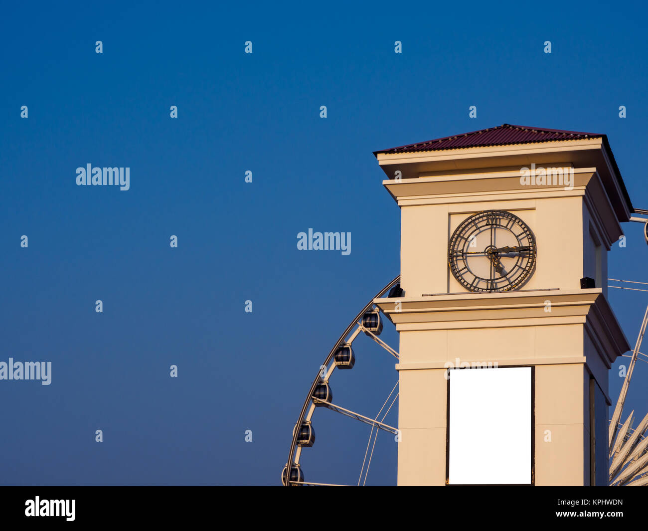 clock tower with ferris wheel and blank billboard Stock Photo - Alamy