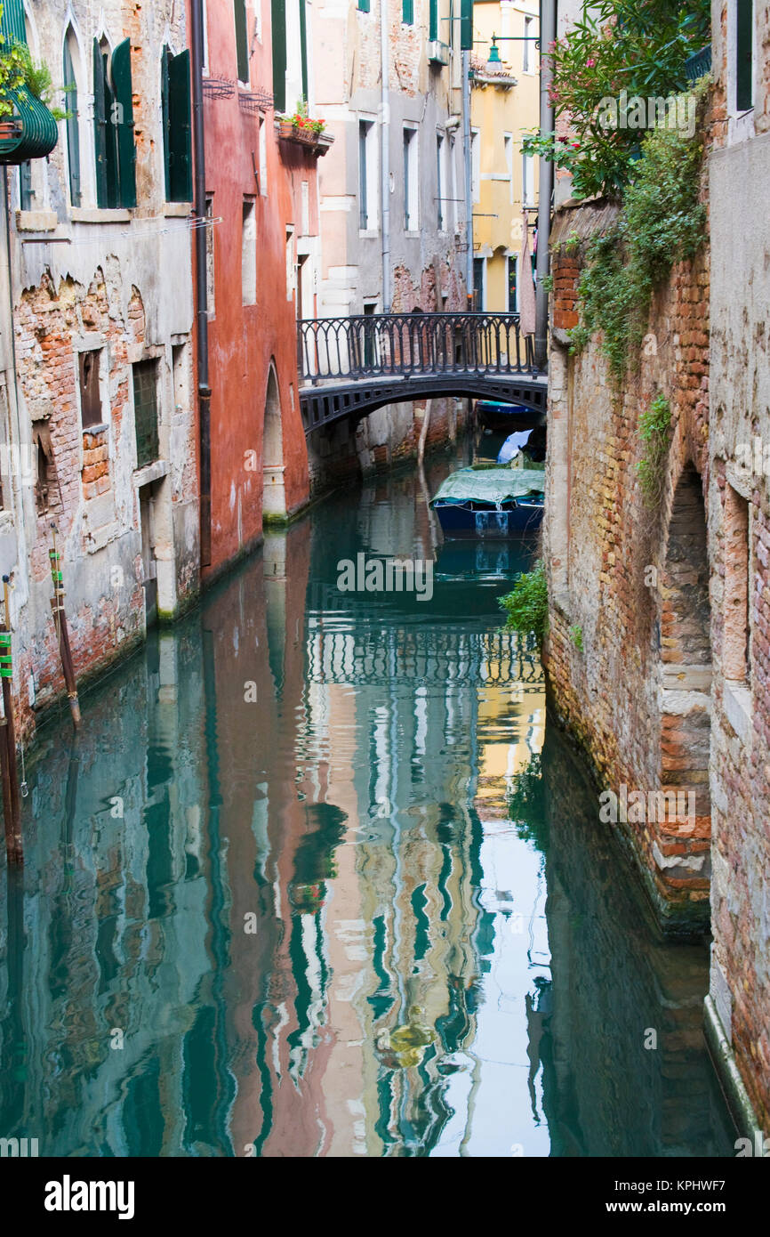 Italy, Venice, Reflections and Small Bridge of Small Canal of Venice ...