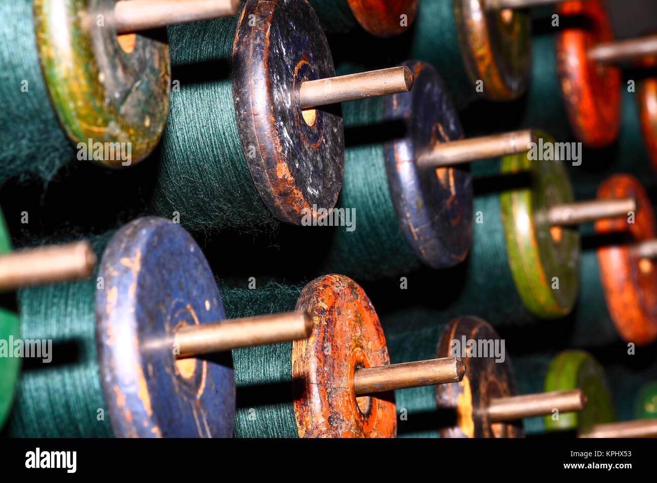 Close up green cotton bobbins loaded on to a weaving loom Stock Photo ...