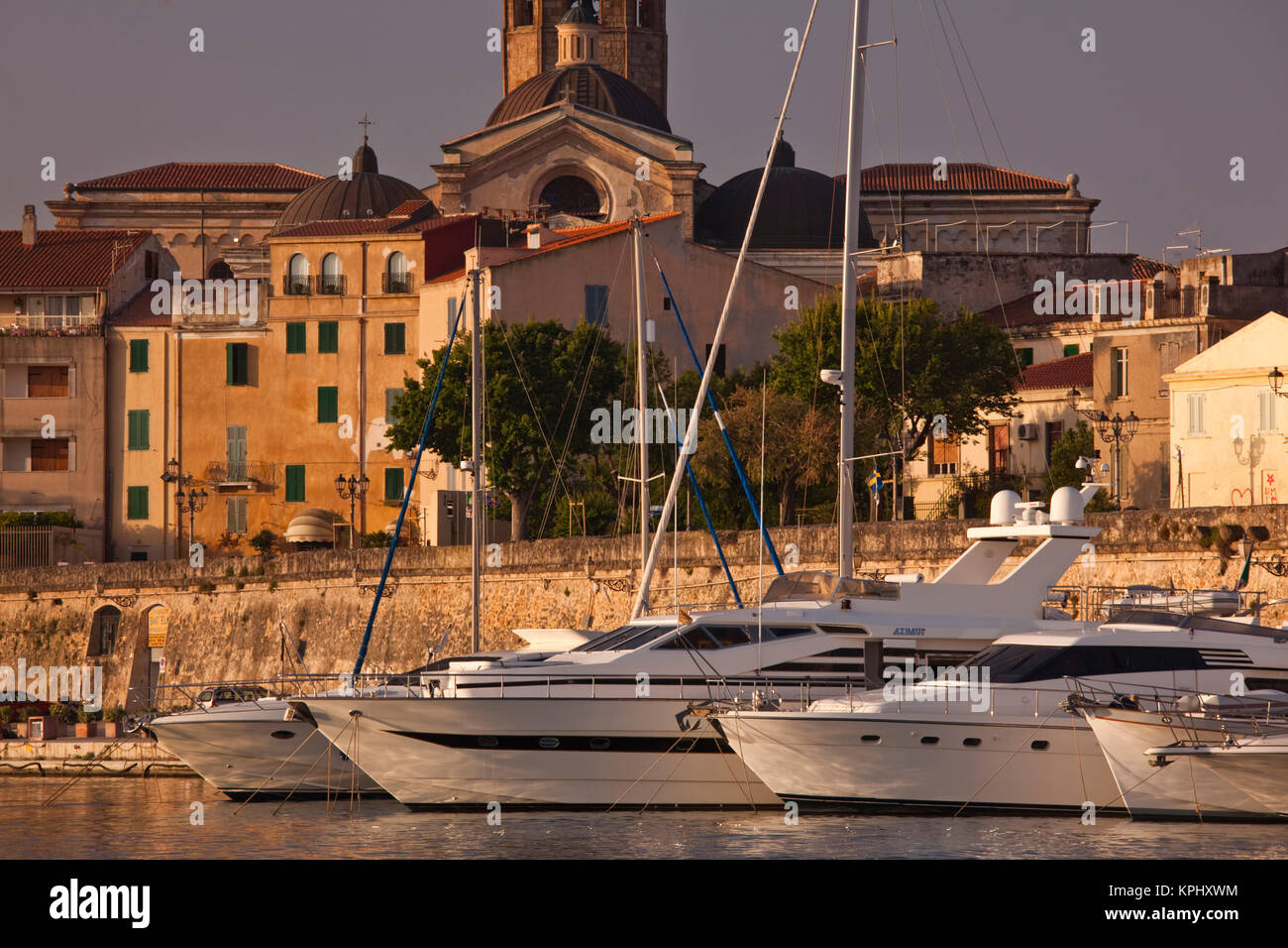 Italy, Sardinia, Alghero. City walls from the yacht marina, sunrise ...