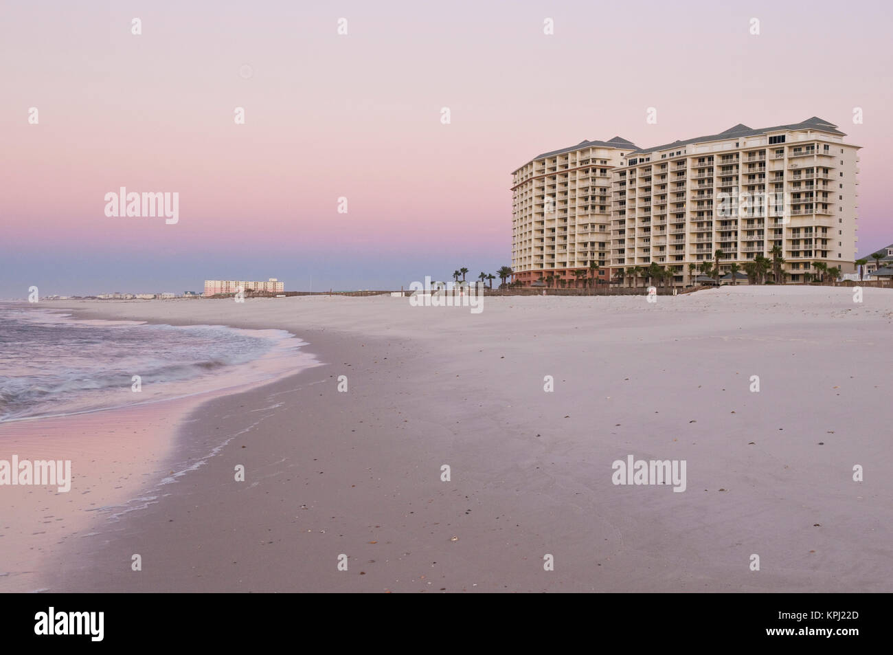 USA, AL, Gulf Shores. Pre dawn colors reflected in wet sand in front of ...