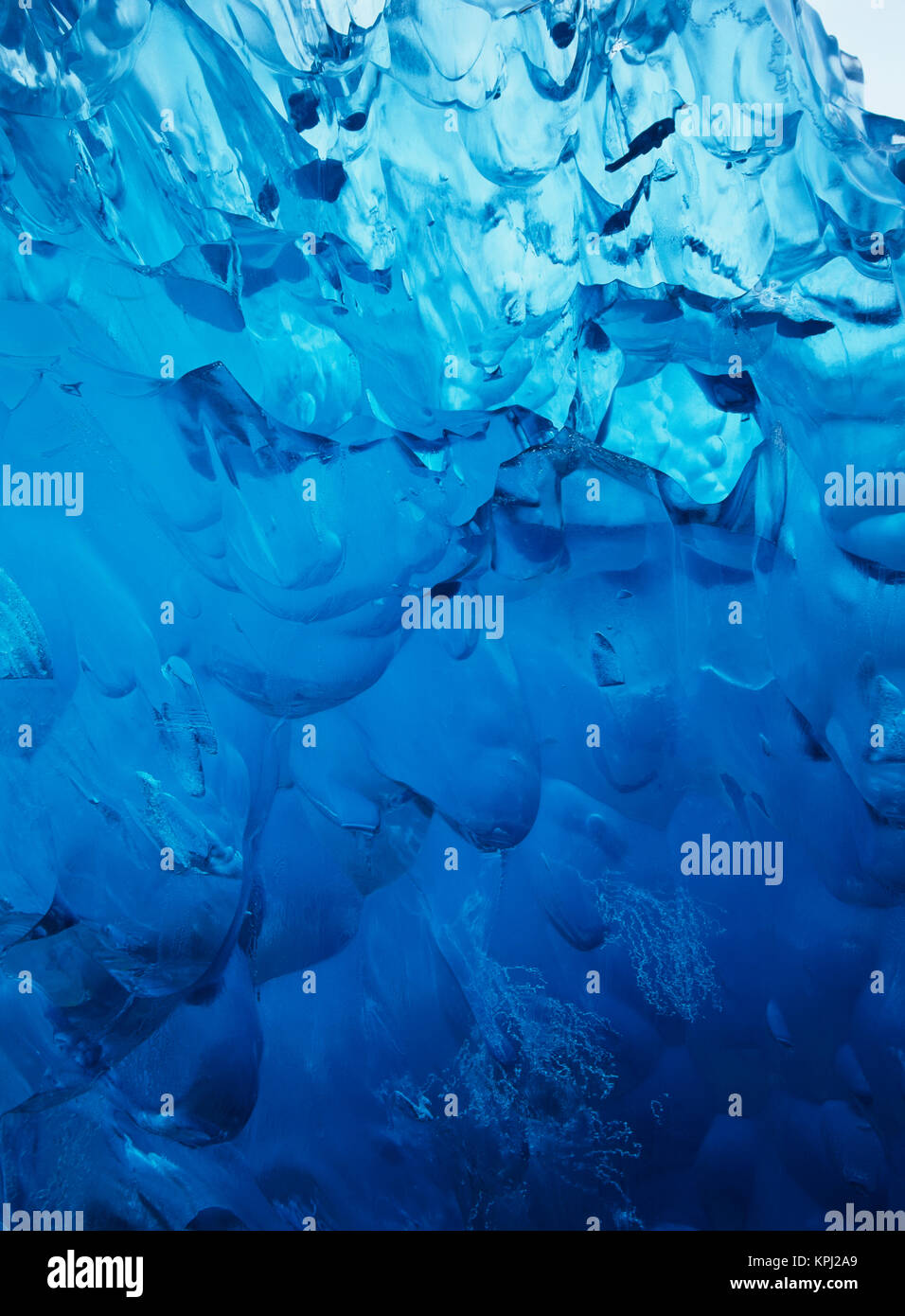 USA, southeast Alaska, View of blue pattern stranded iceberg with Tracy ...