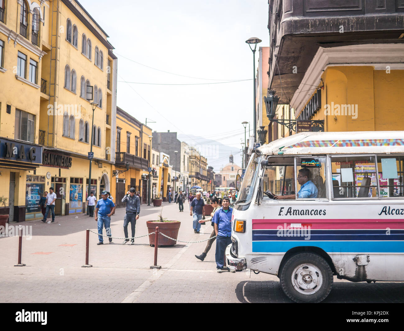 Lima, Peru - October 11, 2014 - A typical Lima bus crossing in front of ...