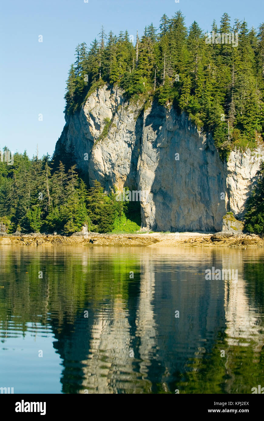 North America, USA, AK, Inside Passage. Limestone cliffs reflected in ...