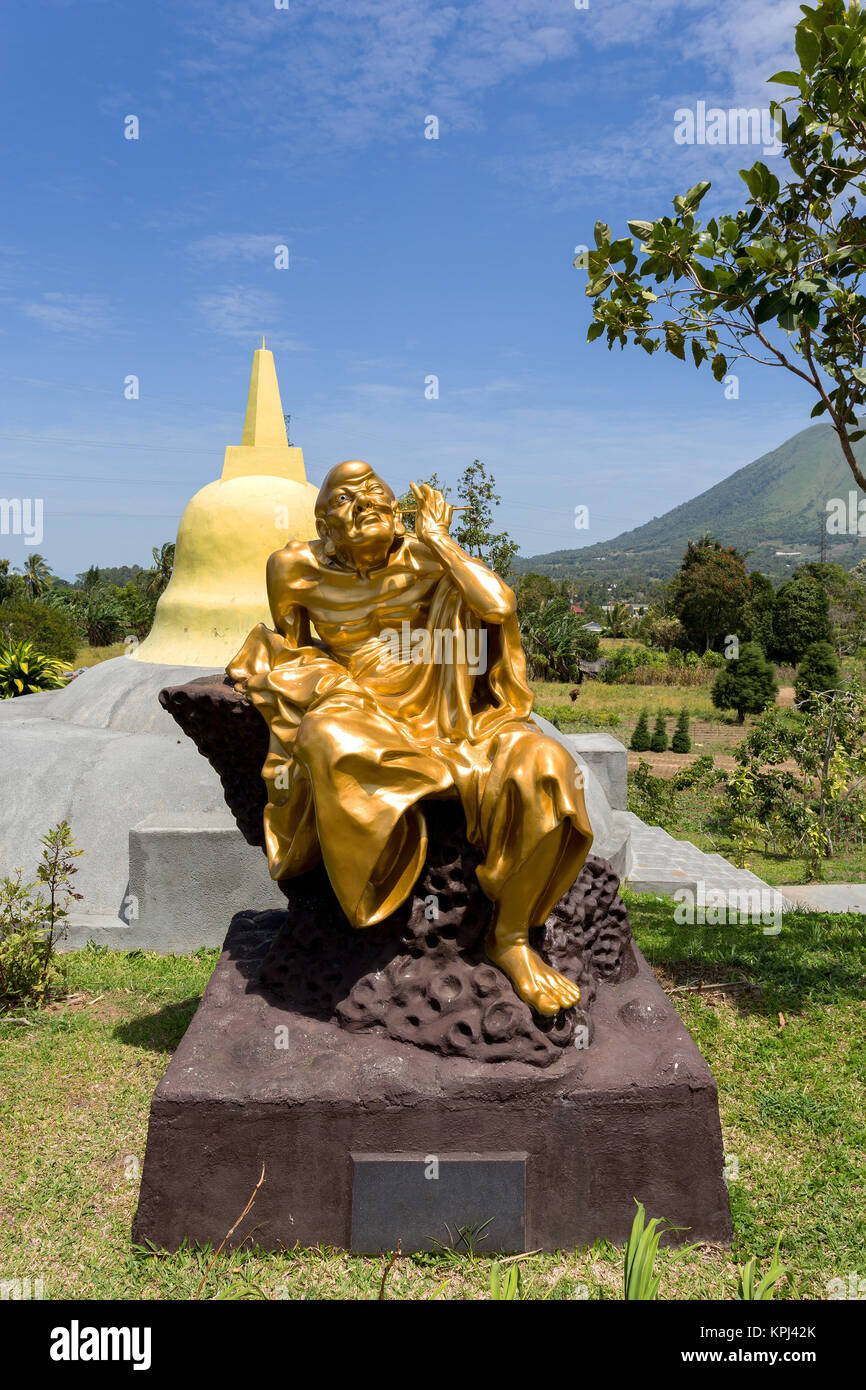 fat monk statue in complex Pagoda Ekayana Stock Photo - Alamy