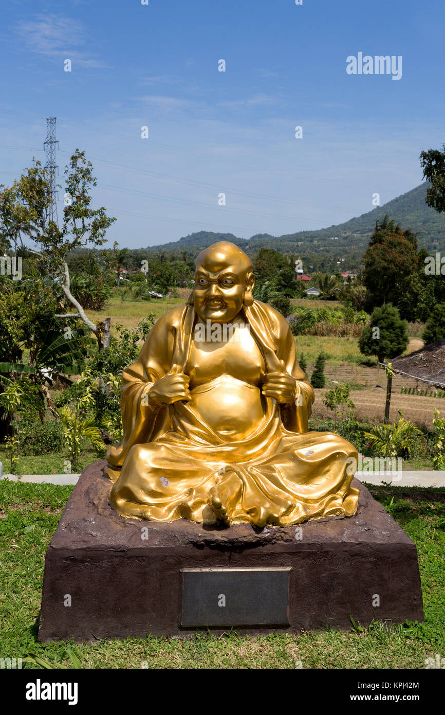 fat monk statue in complex Pagoda Ekayana Stock Photo - Alamy