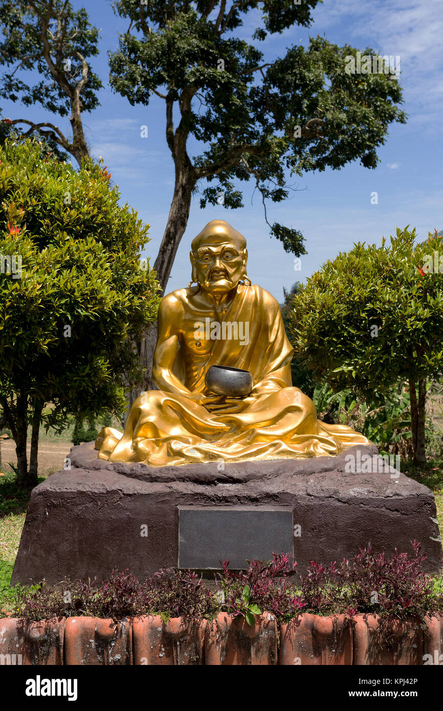 fat monk statue in complex Pagoda Ekayana Stock Photo - Alamy