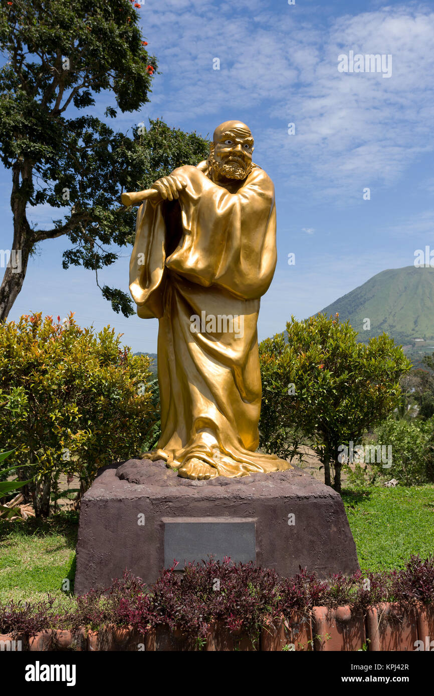fat monk statue in complex Pagoda Ekayana Stock Photo - Alamy