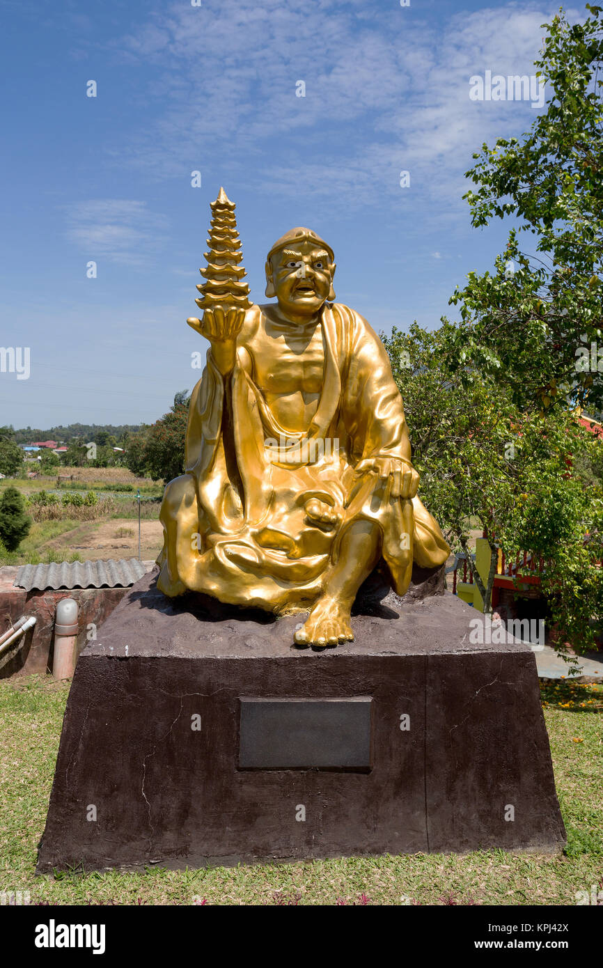 fat monk statue in complex Pagoda Ekayana Stock Photo - Alamy