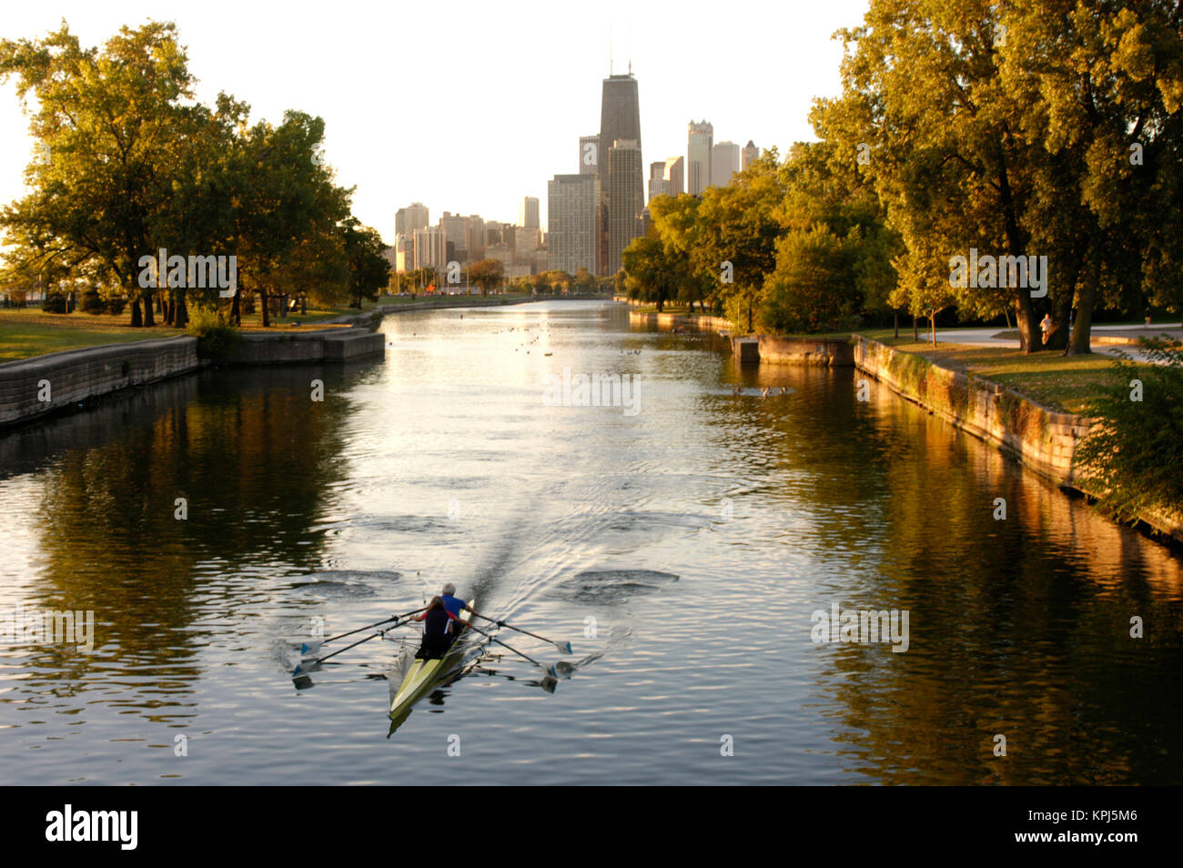 Chicago, Illinois, Rowers in Lincoln Park lagoon at dawn. Chicago ...