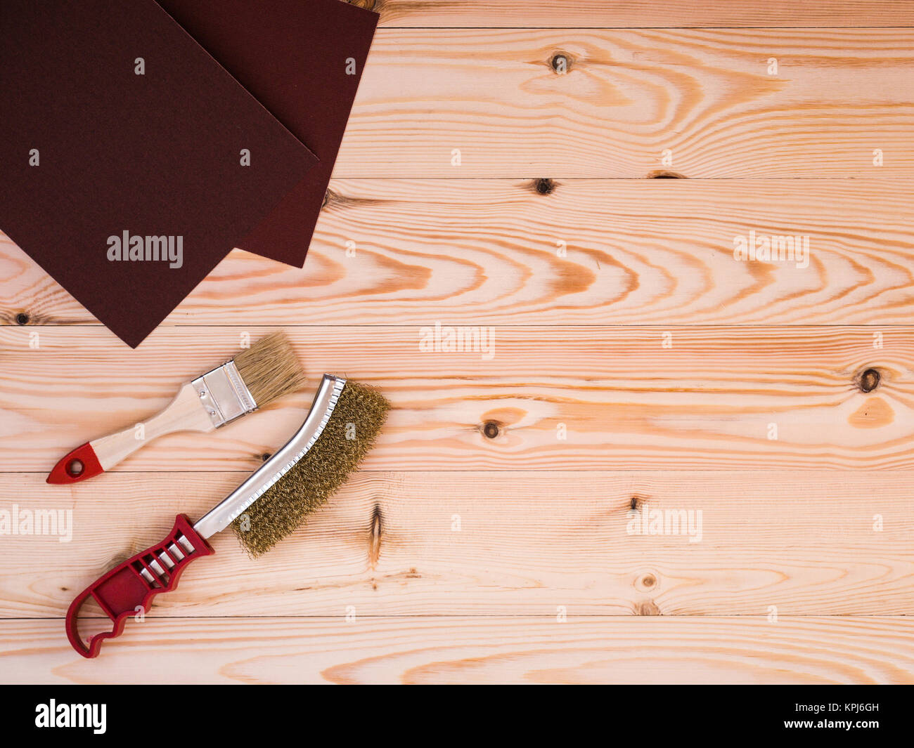 tools for painting and repair on wood background Stock Photo - Alamy