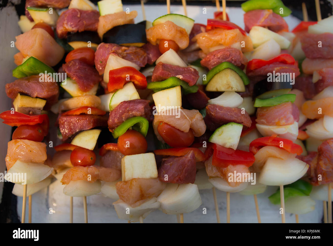 Meat and vegetable brochettes raw Stock Photo - Alamy