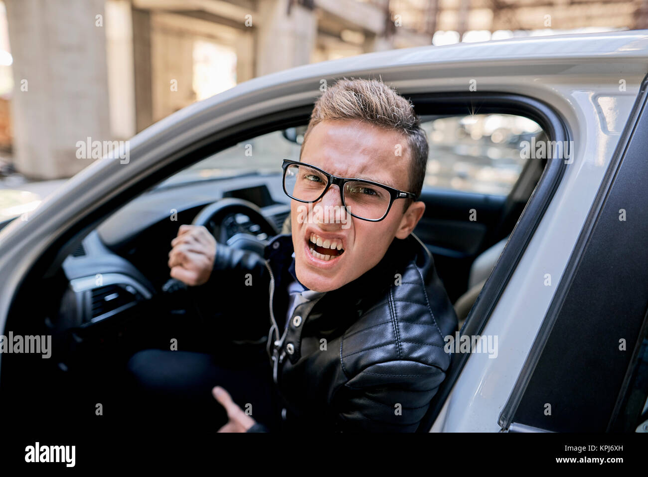 man gets out of the car Stock Photo - Alamy