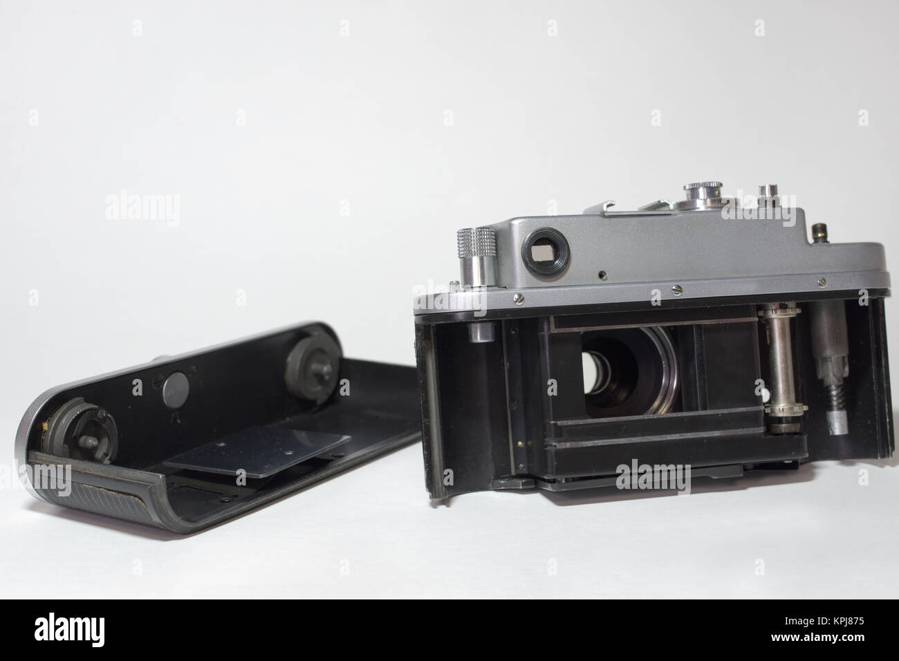 partially disassembled a vintage camera with opened shutter curtain and ...