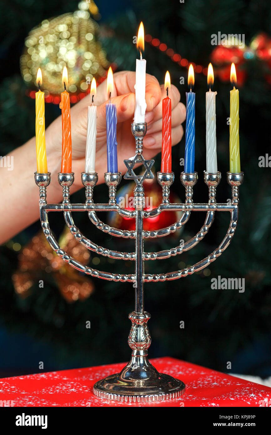 Menorah with candles for Hanukkah on the background of the New Year ...
