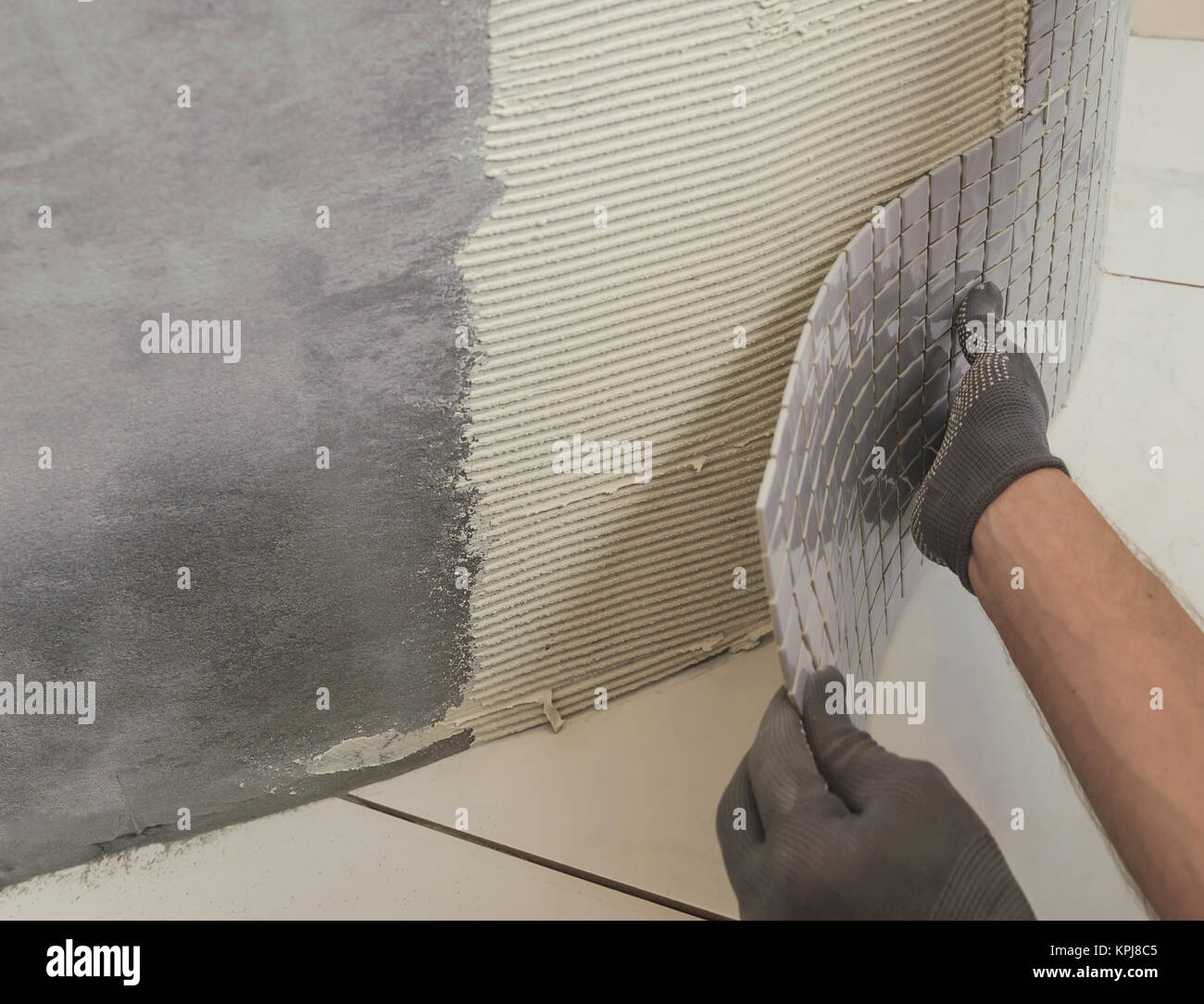 Applying tiles hi-res stock photography and images - Alamy
