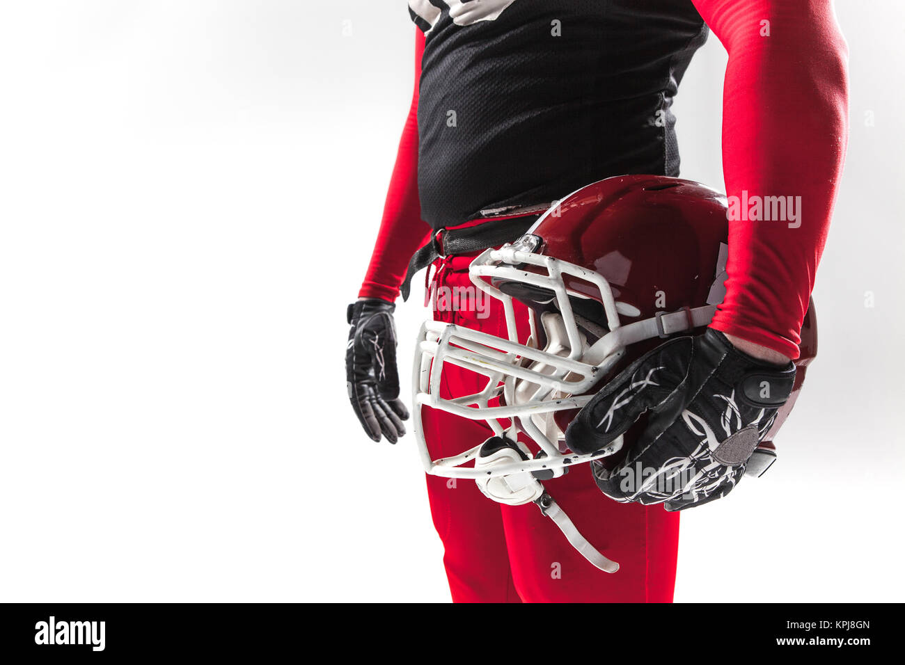 American football player posing with helmet on white background Stock ...