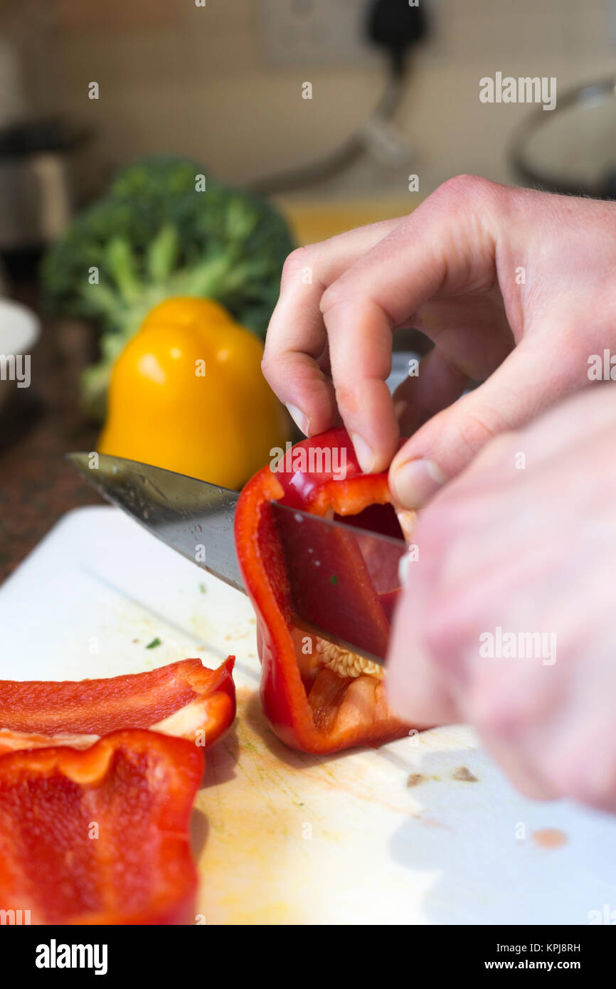 Cutting up bell peppers Stock Photo - Alamy