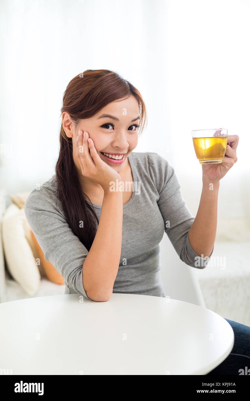 Woman enjoy having tea at home Stock Photo - Alamy