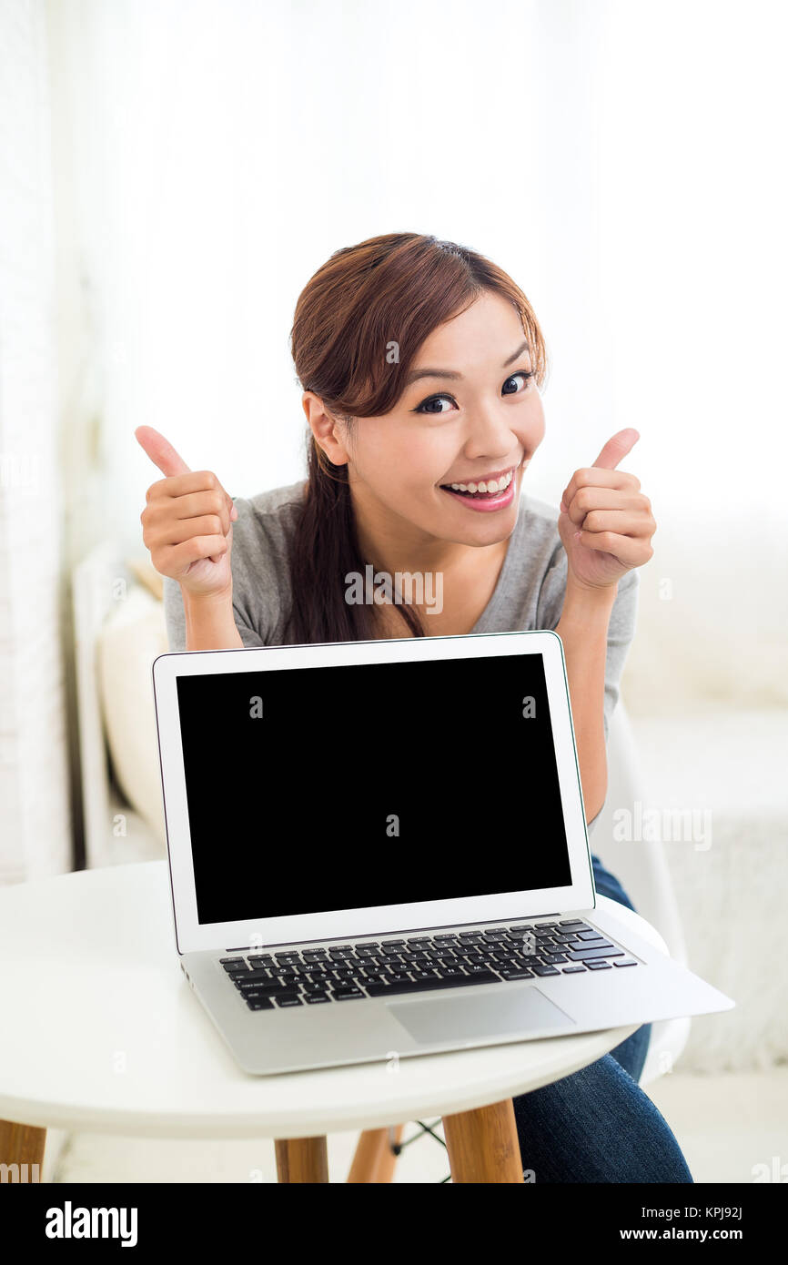 Young woman showing thumb up and laptop computer blank screen Stock ...