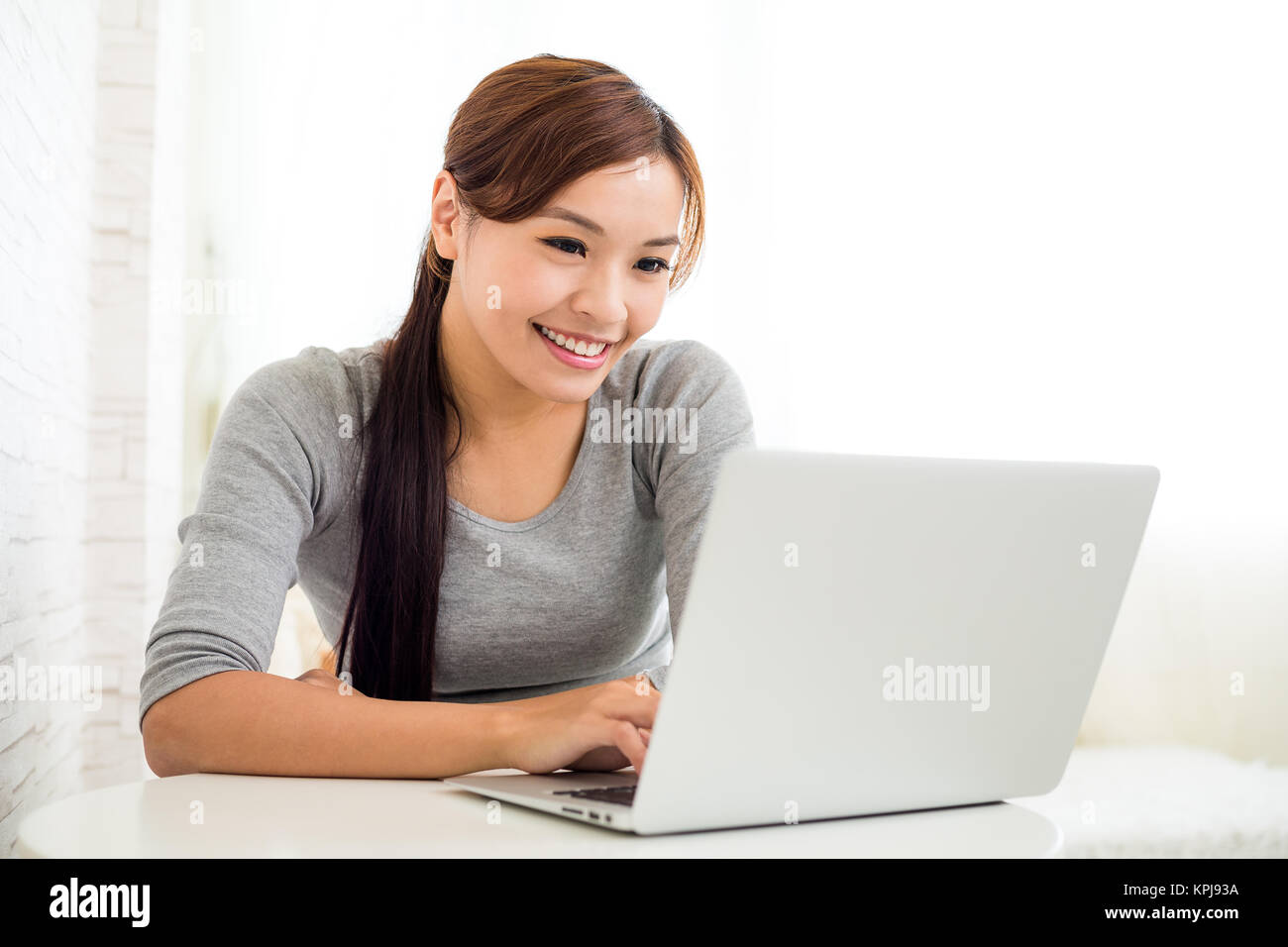 Asian Woman use of the laptop computer Stock Photo - Alamy