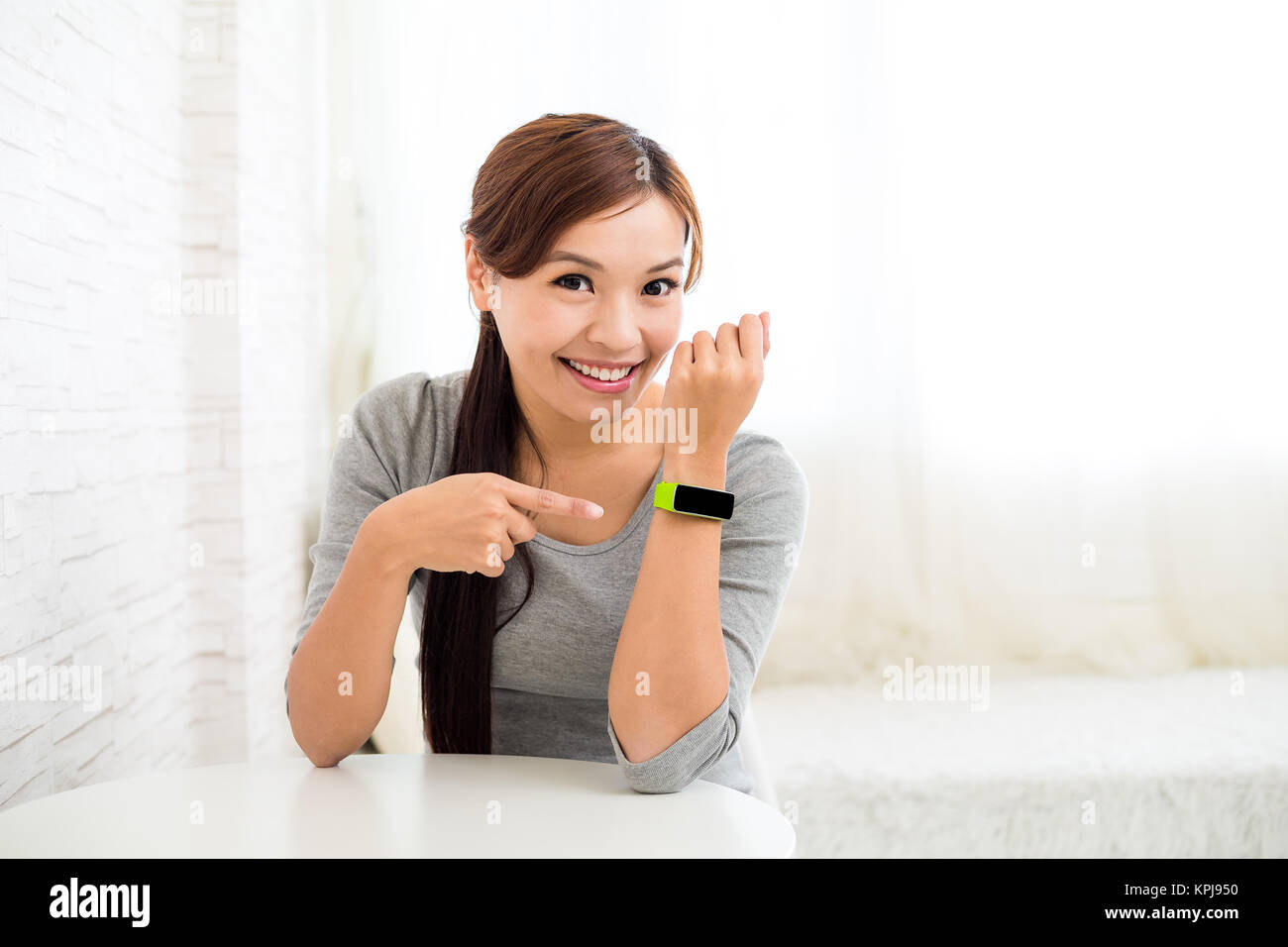 Young woman wearing the sport watch Stock Photo - Alamy