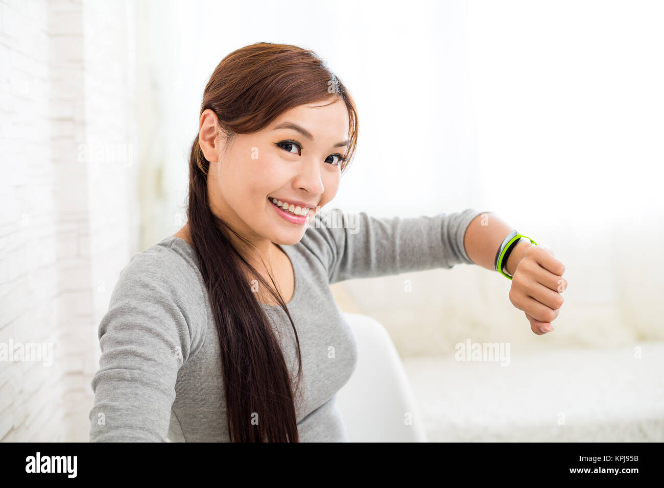 Woman use of the wearable watch Stock Photo - Alamy