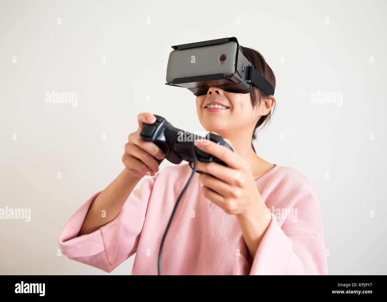 Woman play video game with vr device Stock Photo - Alamy