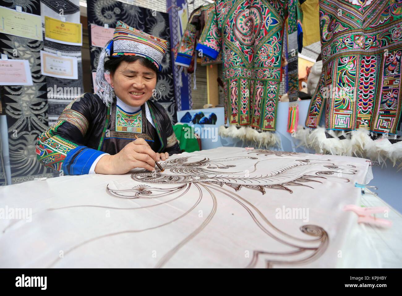 Rongjiang, China's Guizhou Province. 16th Dec, 2017. A villager makes a ...