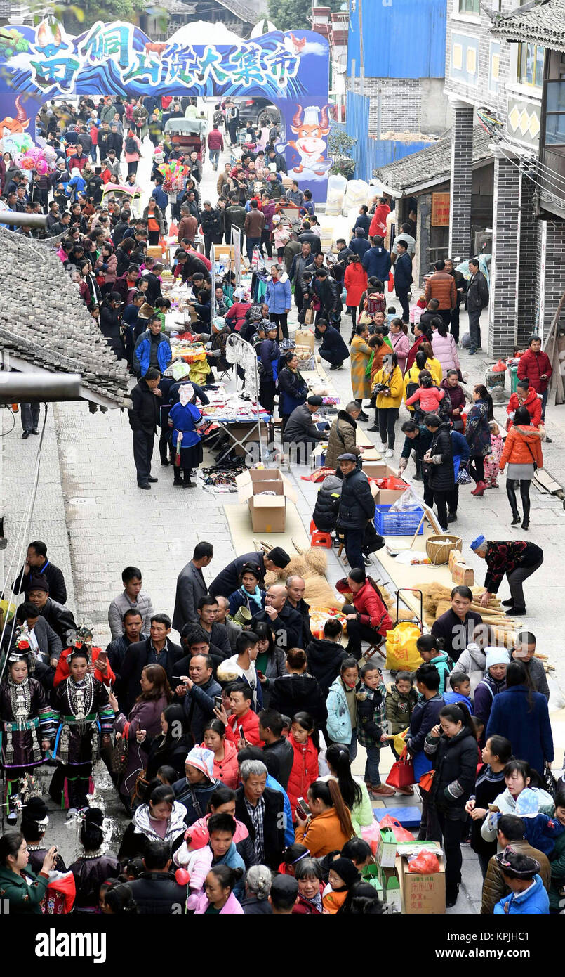 Rongjiang, China's Guizhou Province. 16th Dec, 2017. People select ...