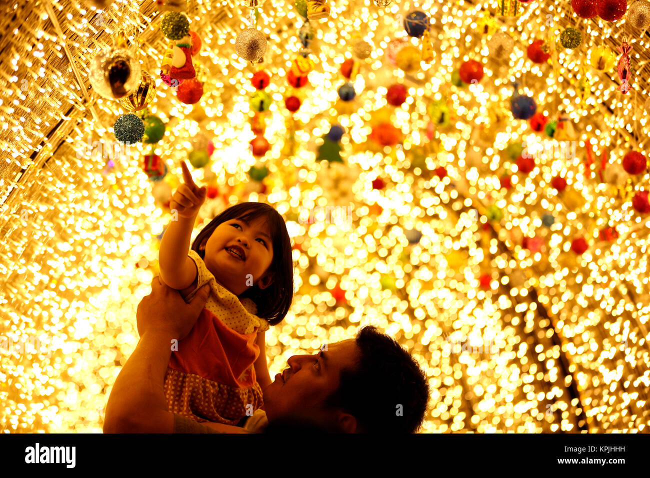 Yangon, Myanmar. 16th Dec, 2017. A child smiles among decorations of ...