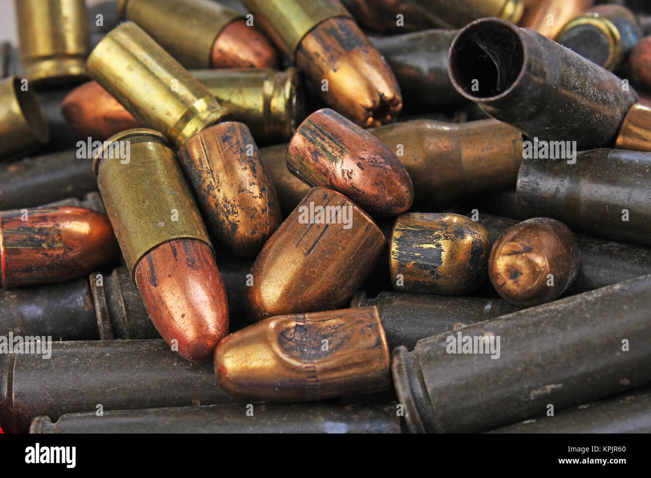 Heap of gun bullets. Weapon Cartridge case sleeve background texture, 7 ...