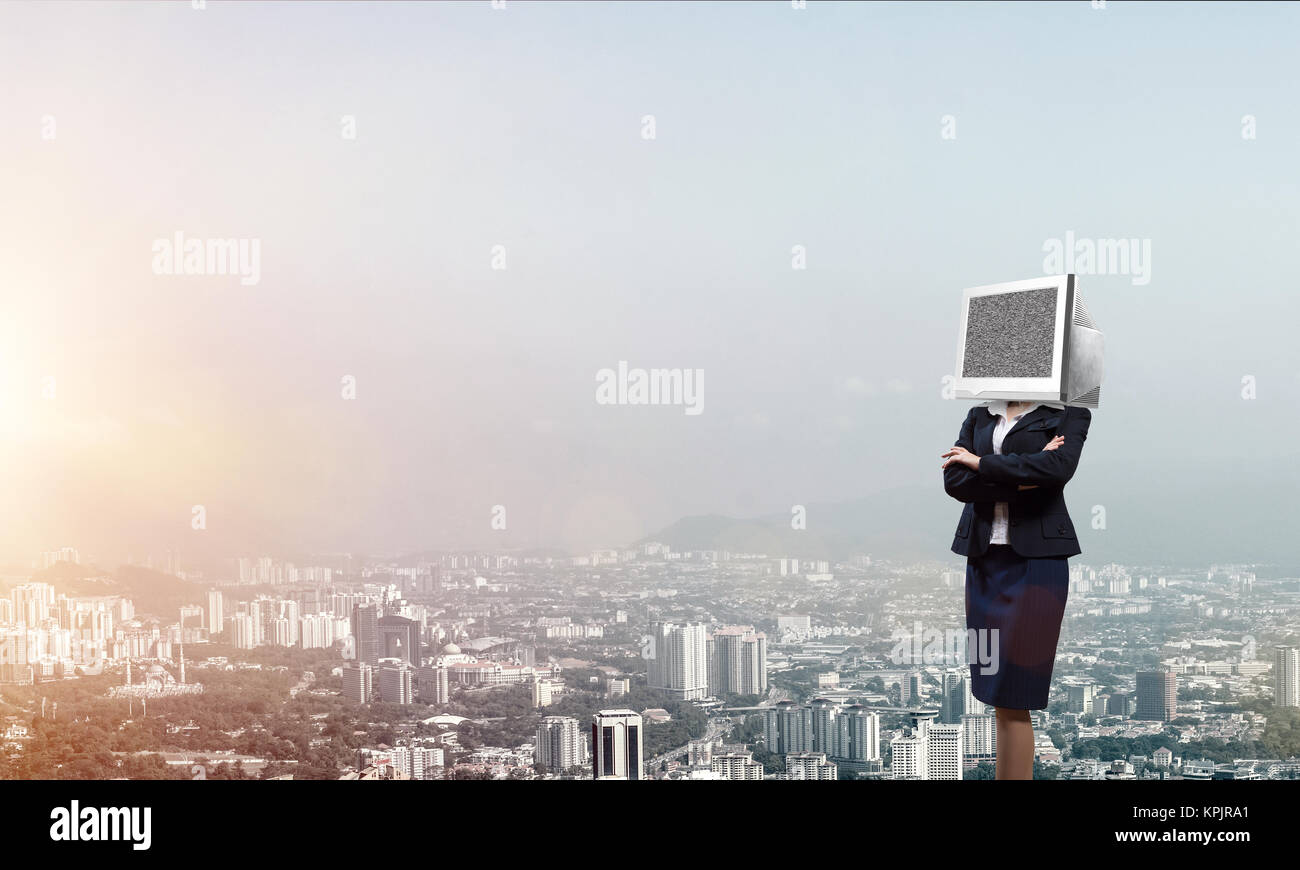 Cropped image of business woman in suit with monitor instead of head ...