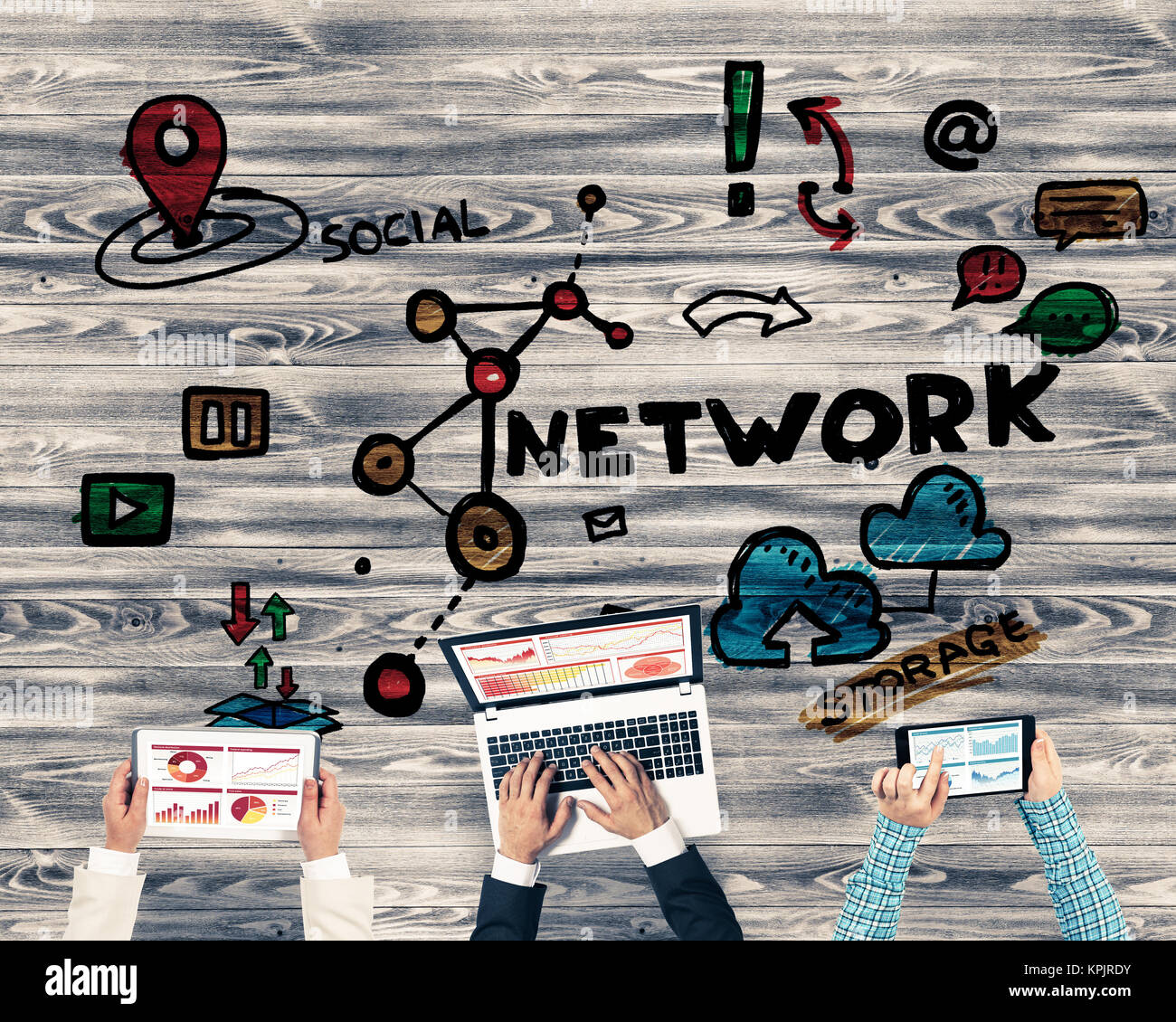 Group of three people with devices in hands working together as symbol ...