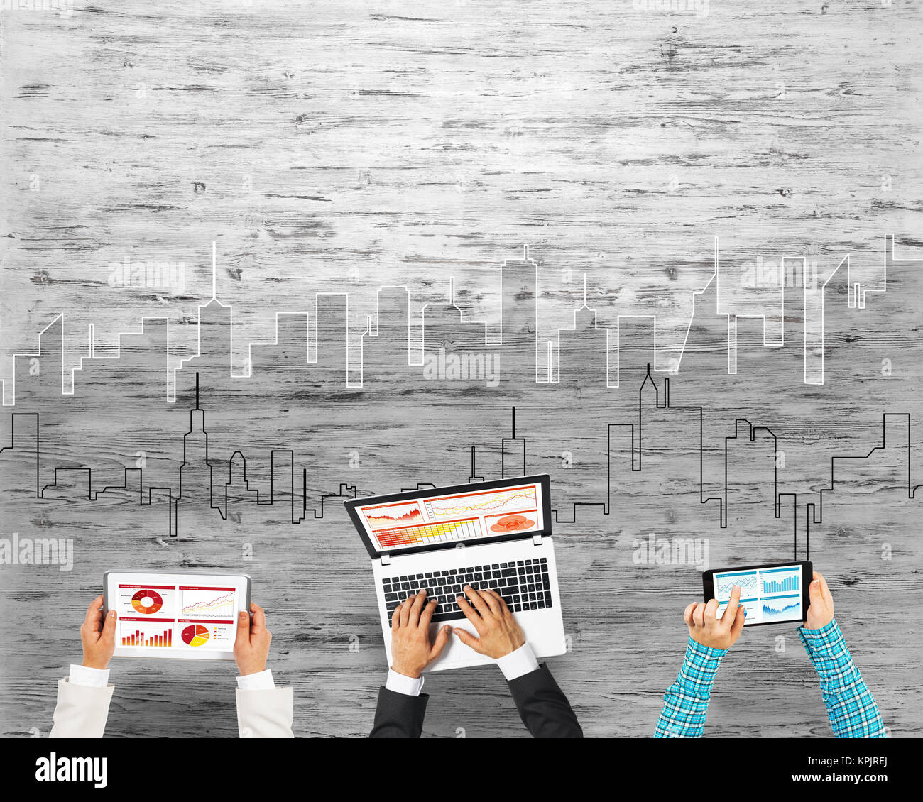 Group of three people with devices in hands working together as symbol ...