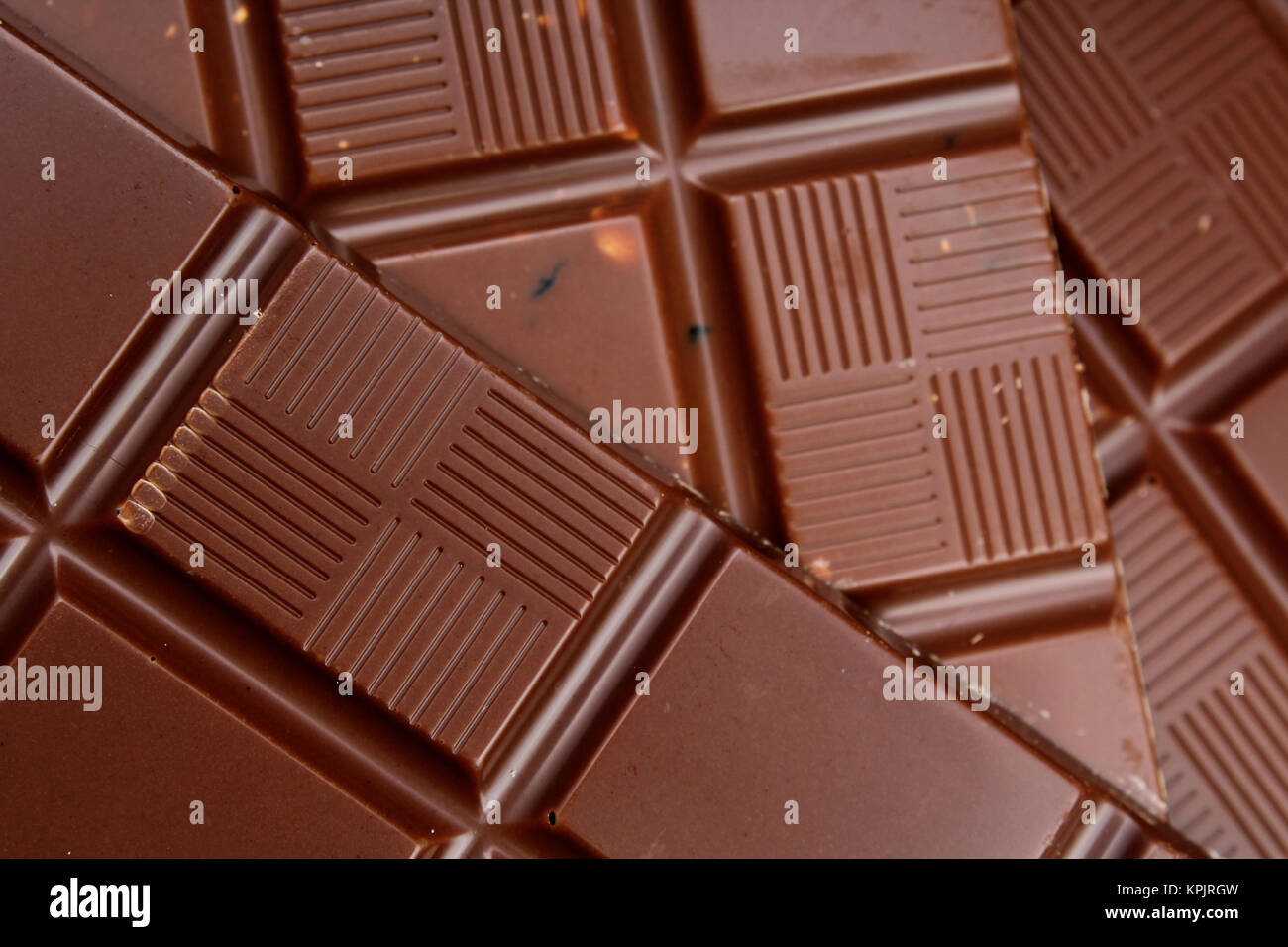 Chocolate bars as background. Milk and dark shiny chocolate texture ...