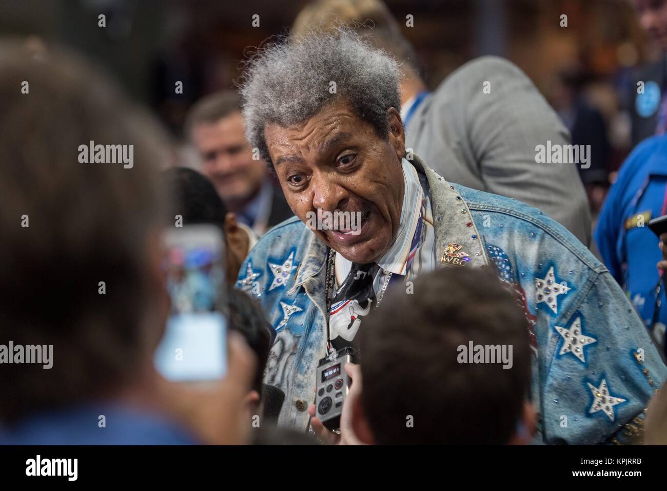 Boxing promoter Don King speaks to reporters on the floor of the ...