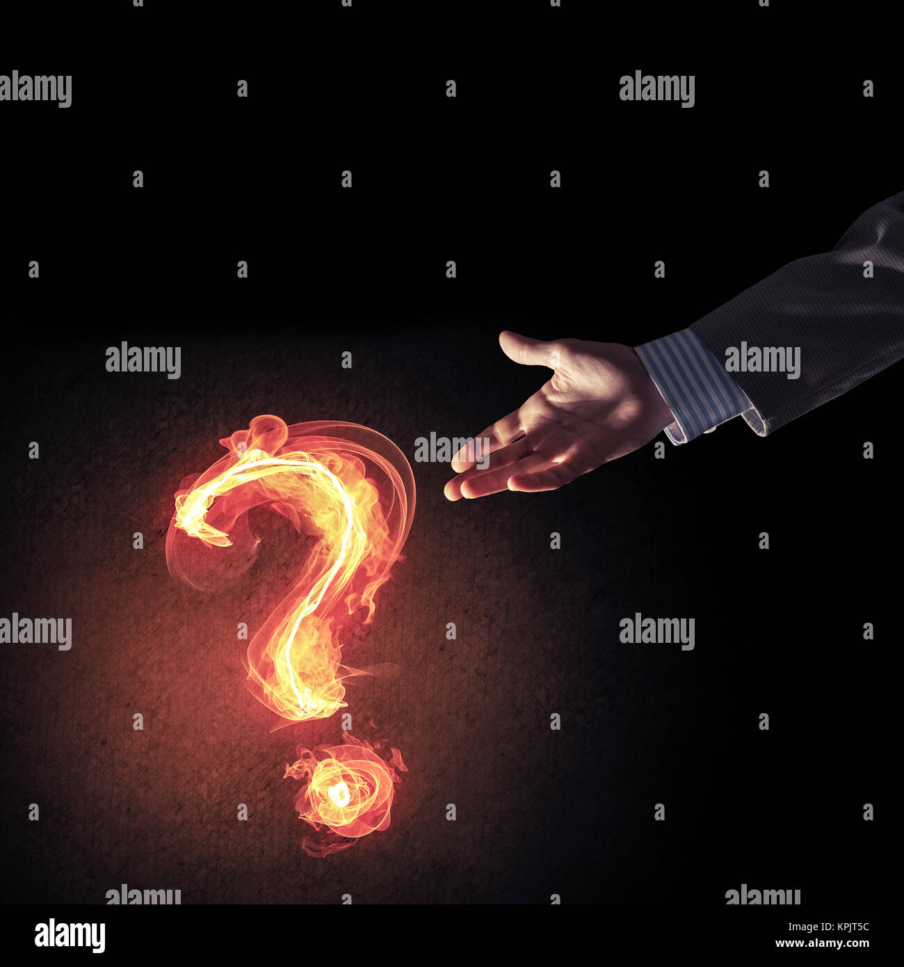 Close of businessman hand showing burning fire sign on dark background ...
