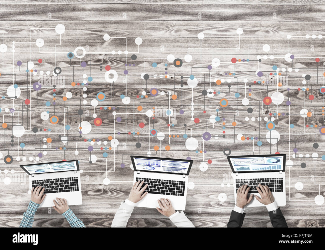 Group of three people with devices in hands working together as symbol ...