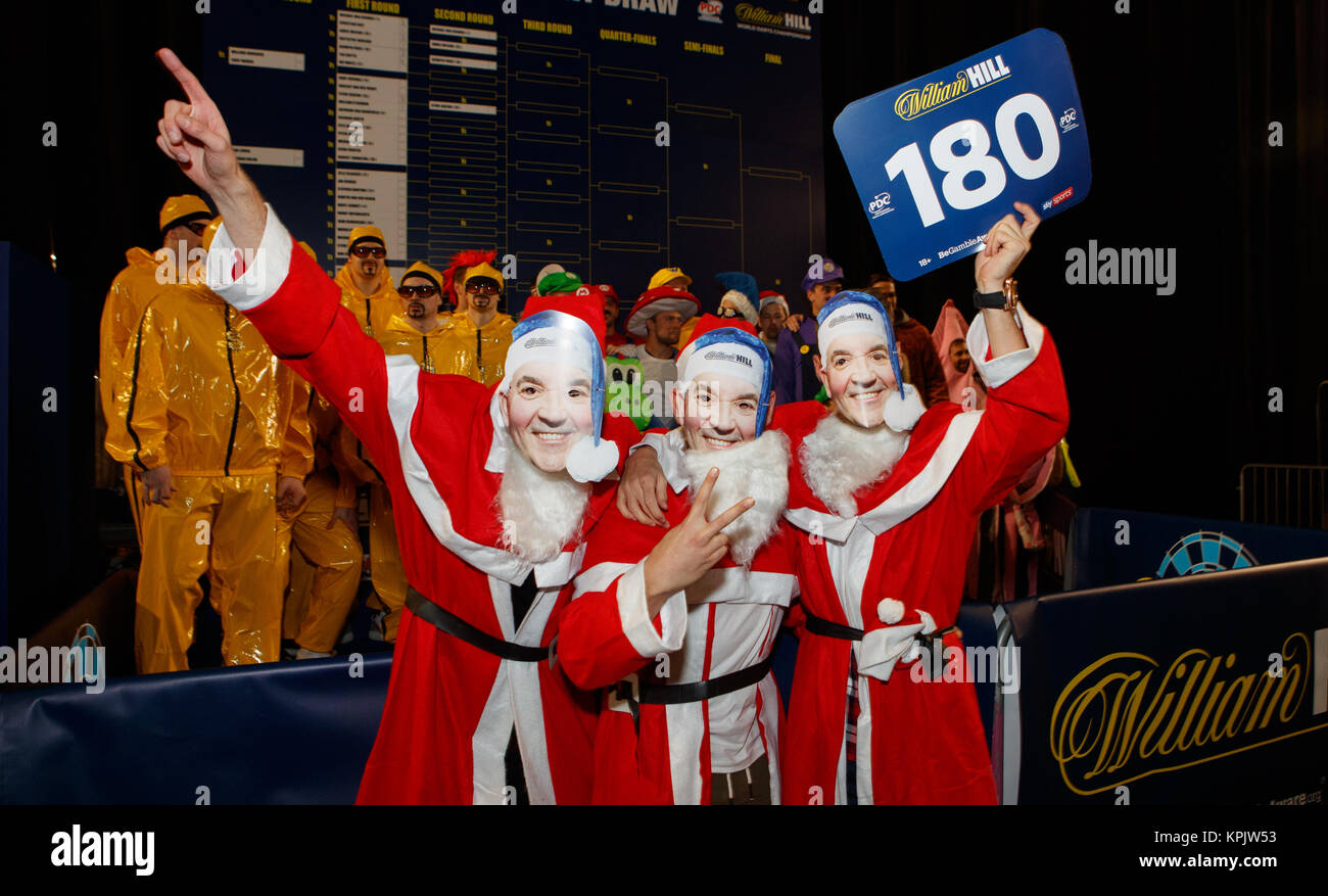 Darts fans wearing Phil Taylor masks before the start of day two of the ...