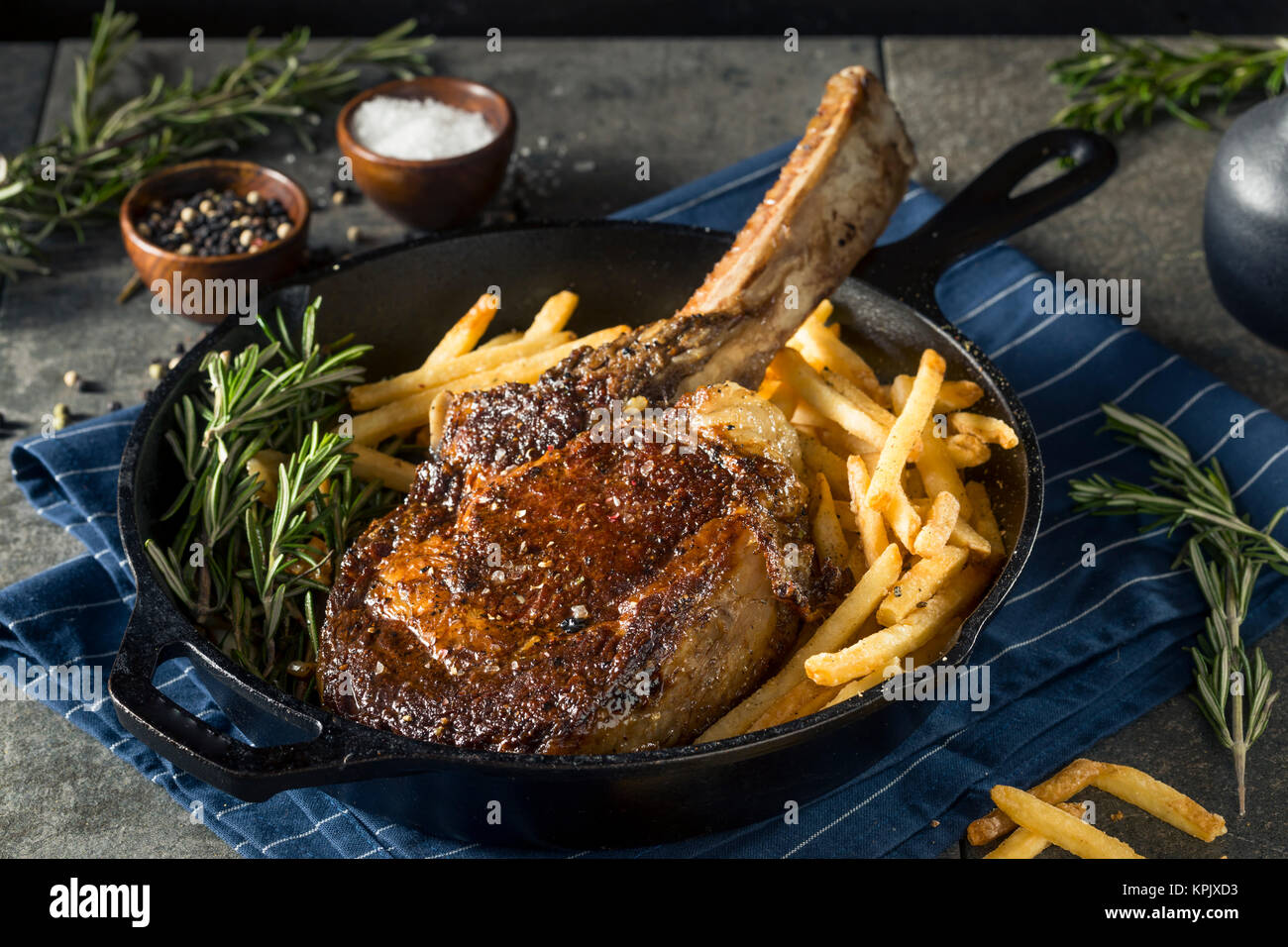 Cooked Grass Fed Tomahawk Steaks with Fries and Rosemary Stock Photo ...
