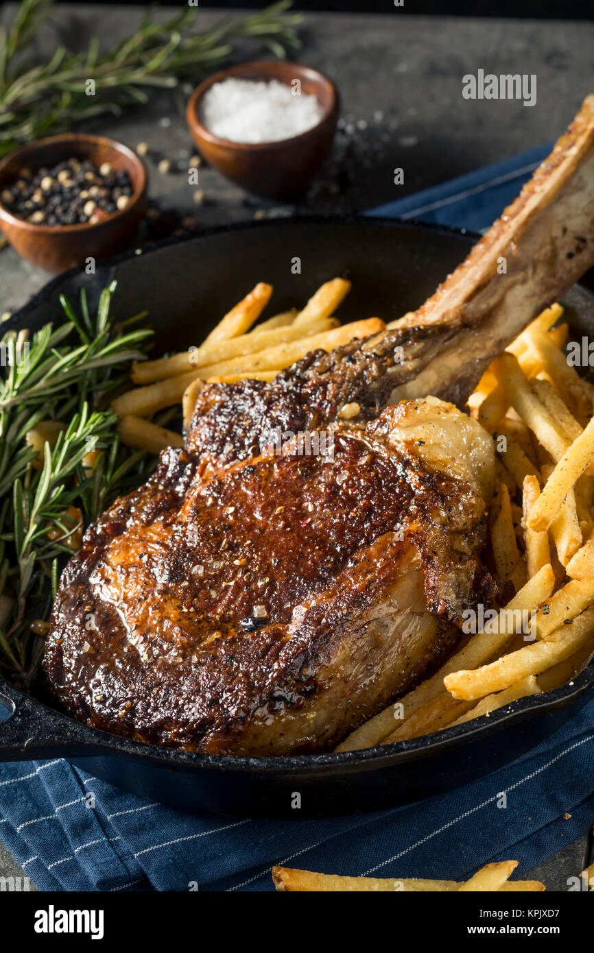 Cooked Grass Fed Tomahawk Steaks with Fries and Rosemary Stock Photo ...