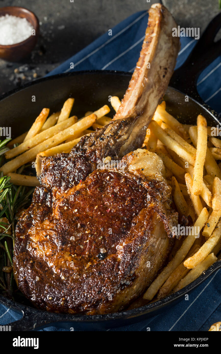Cooked Grass Fed Tomahawk Steaks with Fries and Rosemary Stock Photo ...