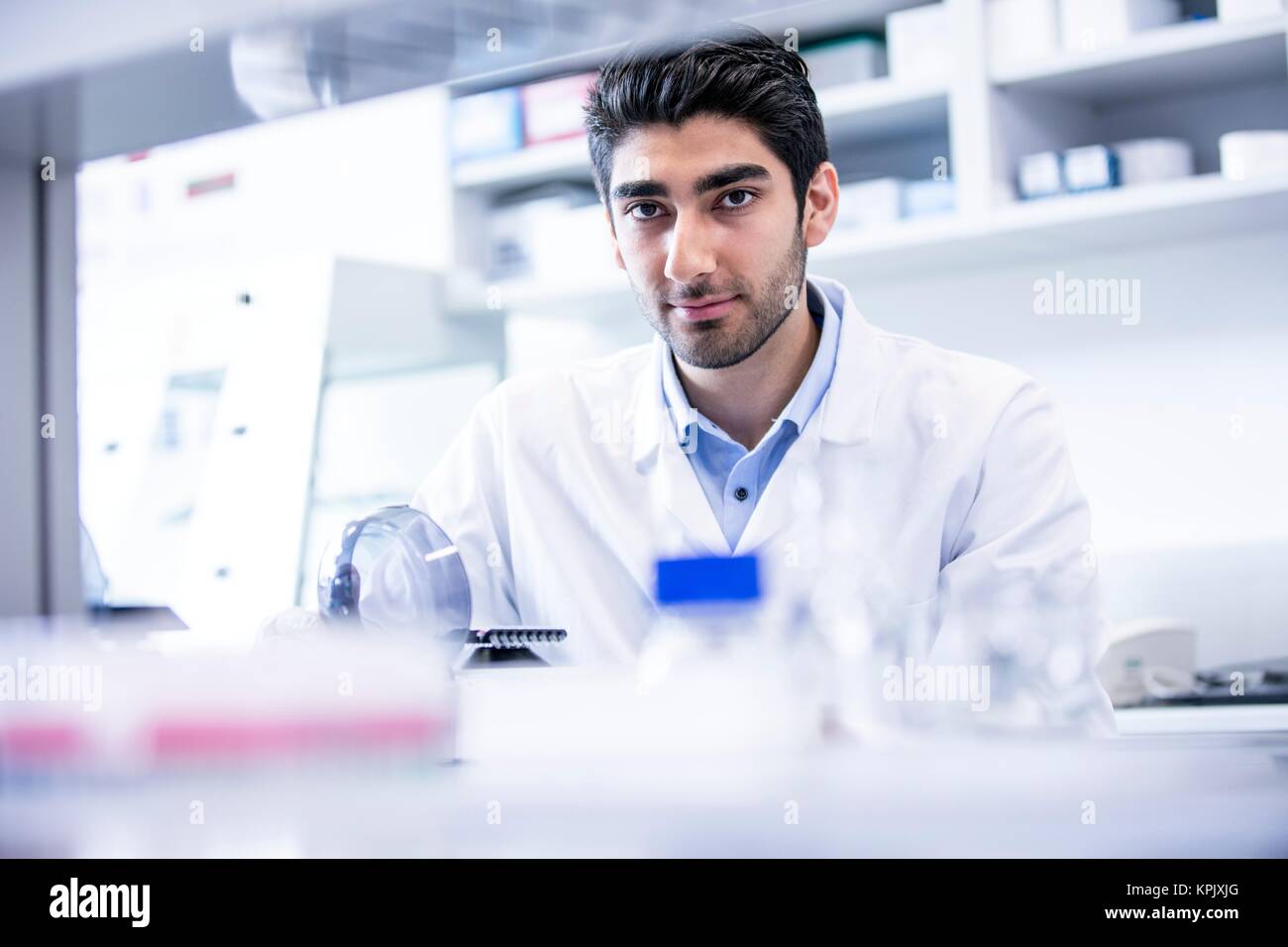 Male laboratory assistant using mini centrifuge Stock Photo - Alamy